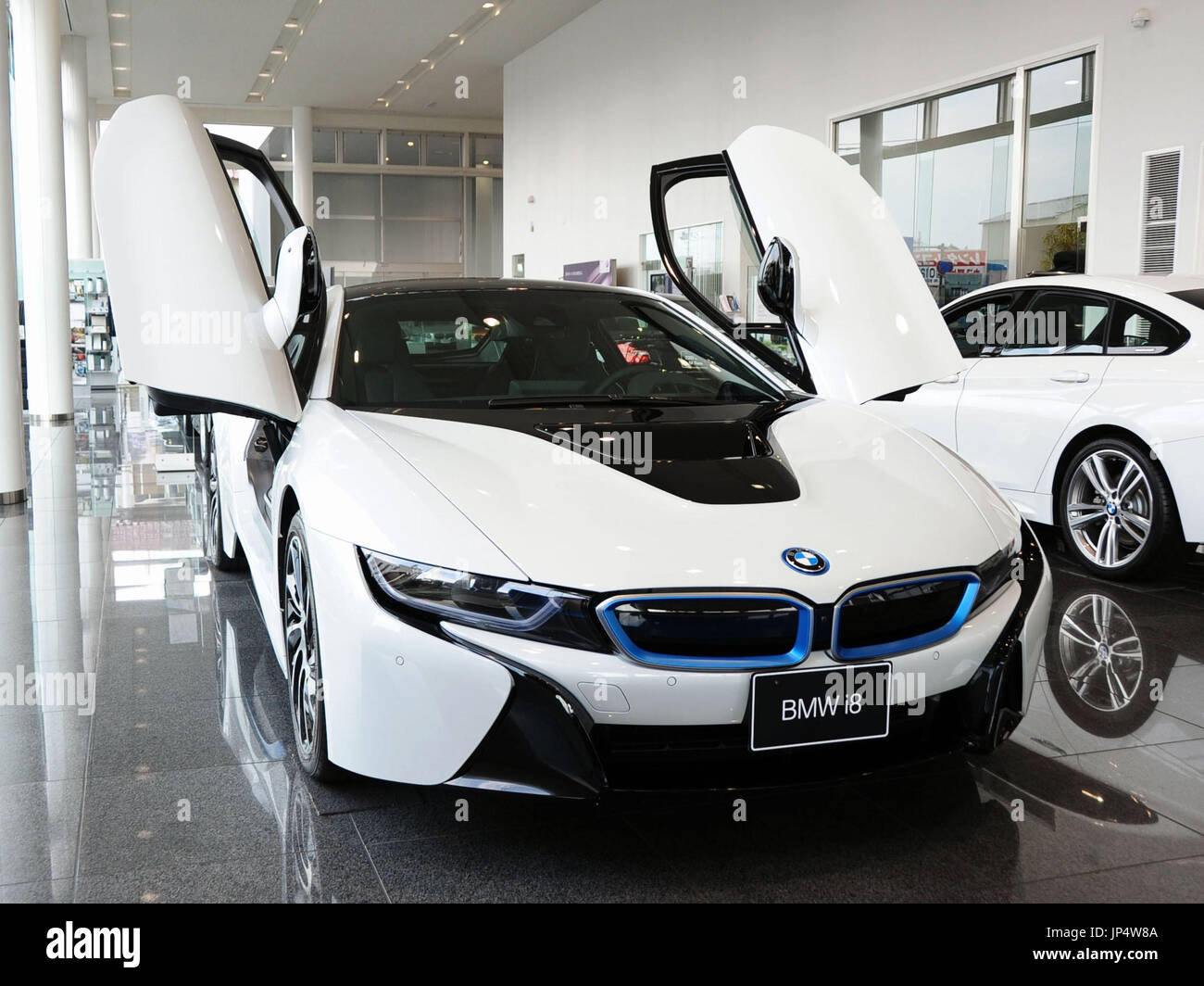 TOKYO, Japan - BMW Japan Corp. unveils an "i8" plug-in hybrid electric vehicle that uses ...