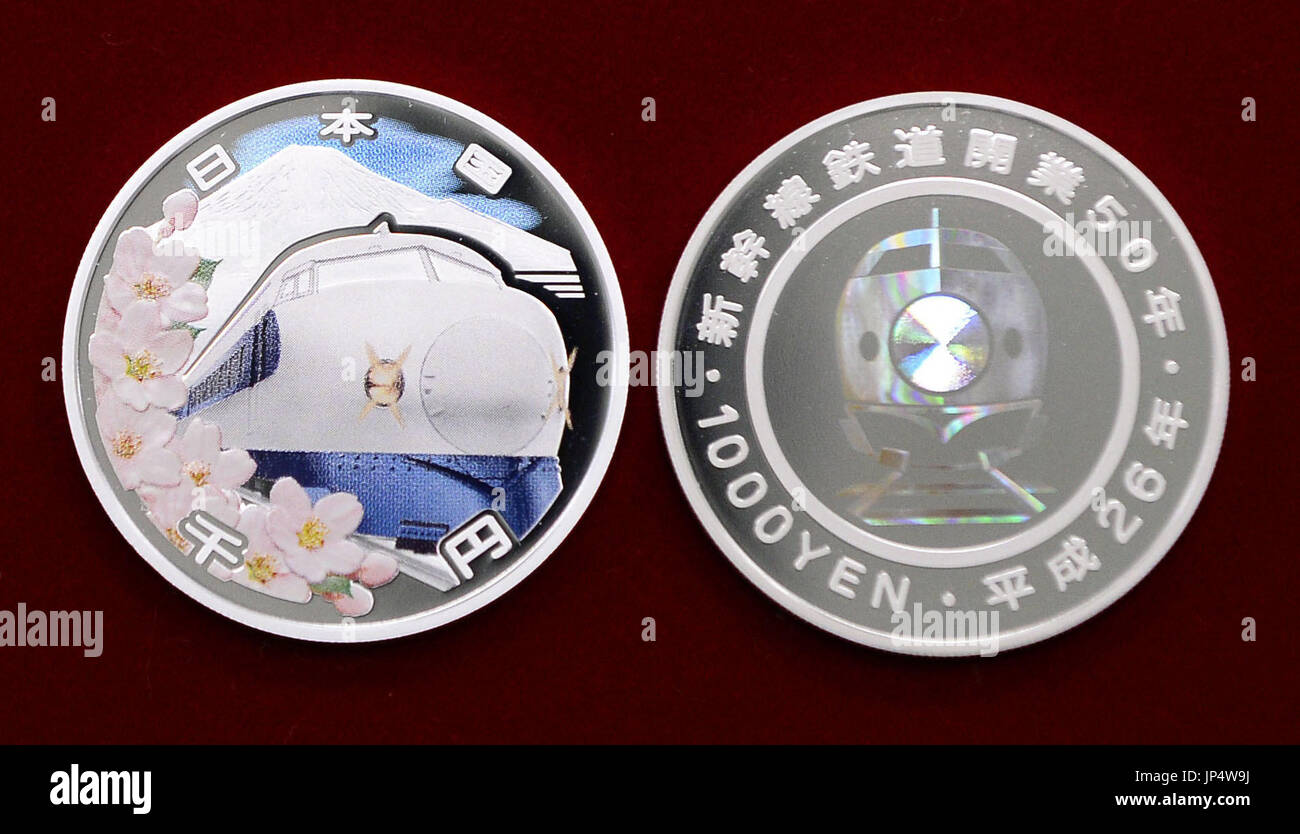 OSAKA, Japan - The obverse (L) and reverse of a 1,000 yen silver coin ...