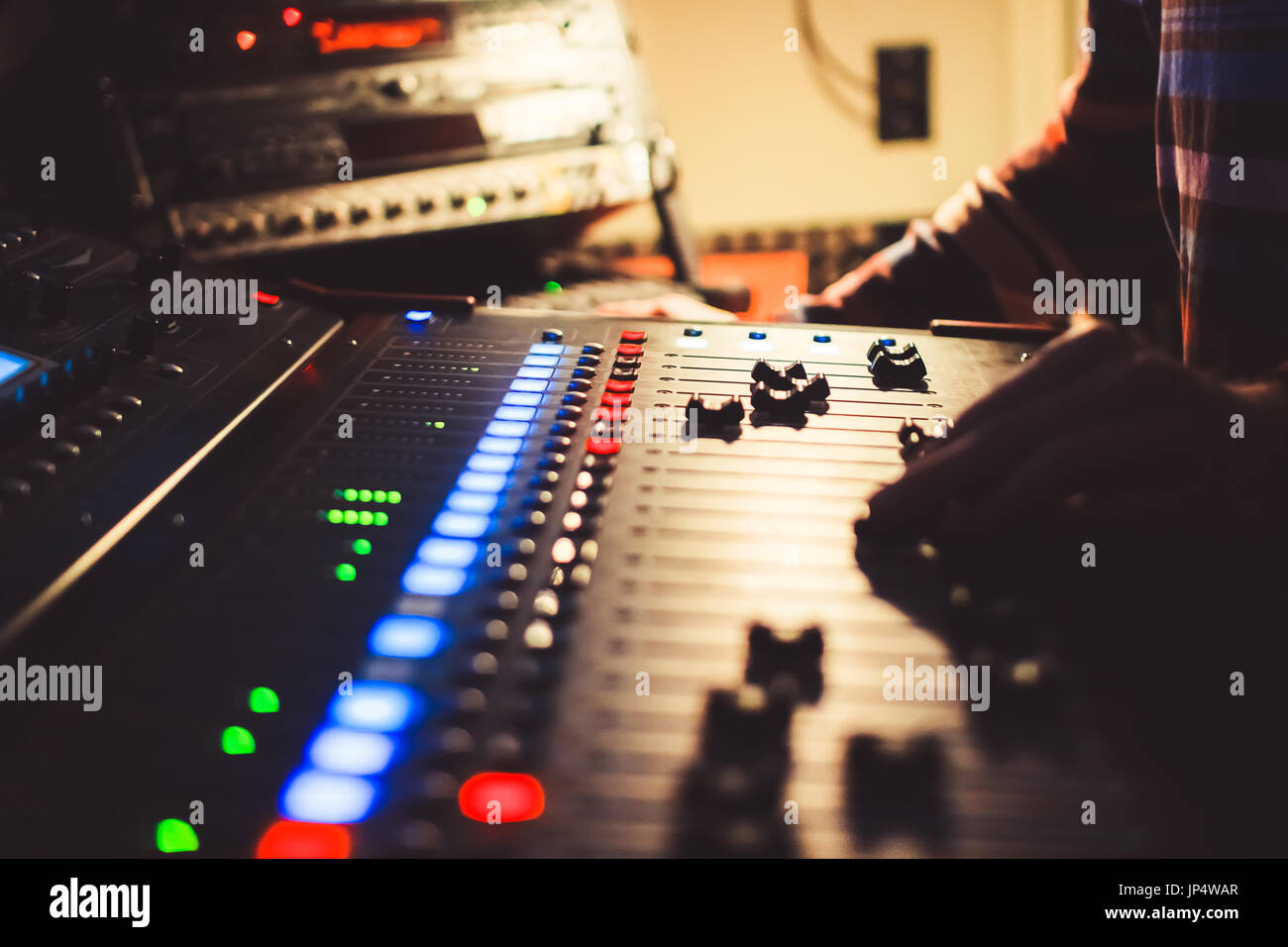 The hands of the sound engineer on the mixing console Stock Photo - Alamy