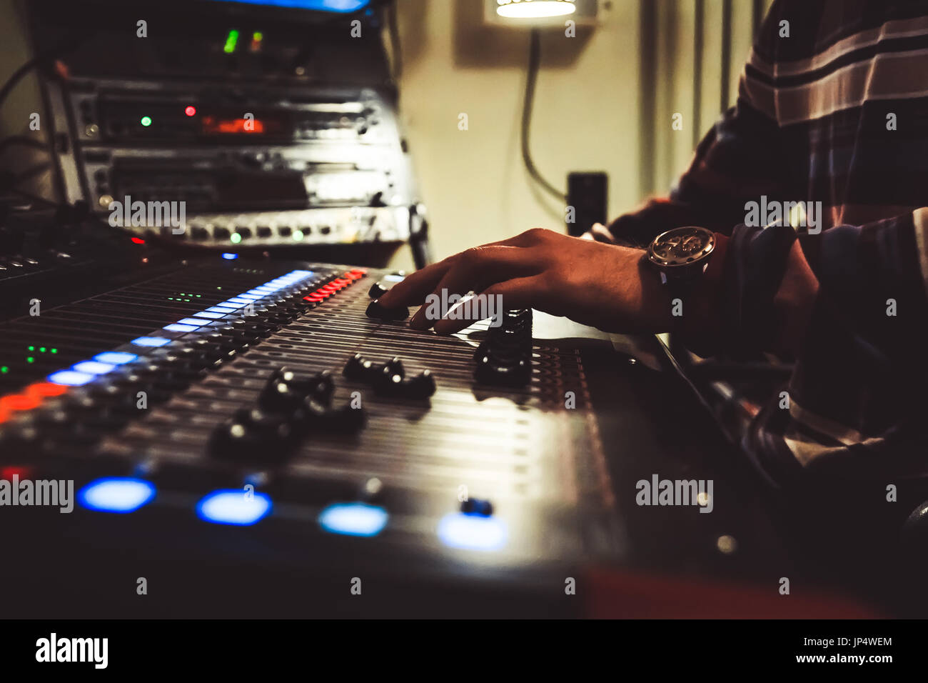 The hands of the sound engineer on the mixing console Stock Photo - Alamy