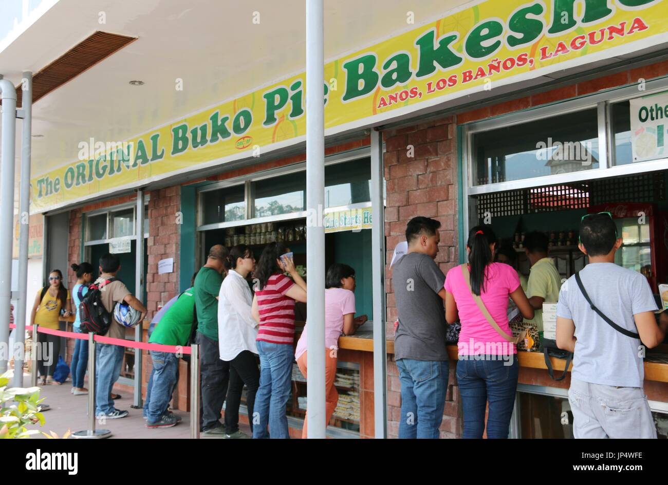 LOS BANOS, Philippines - People wait in line at Orient, the original ...