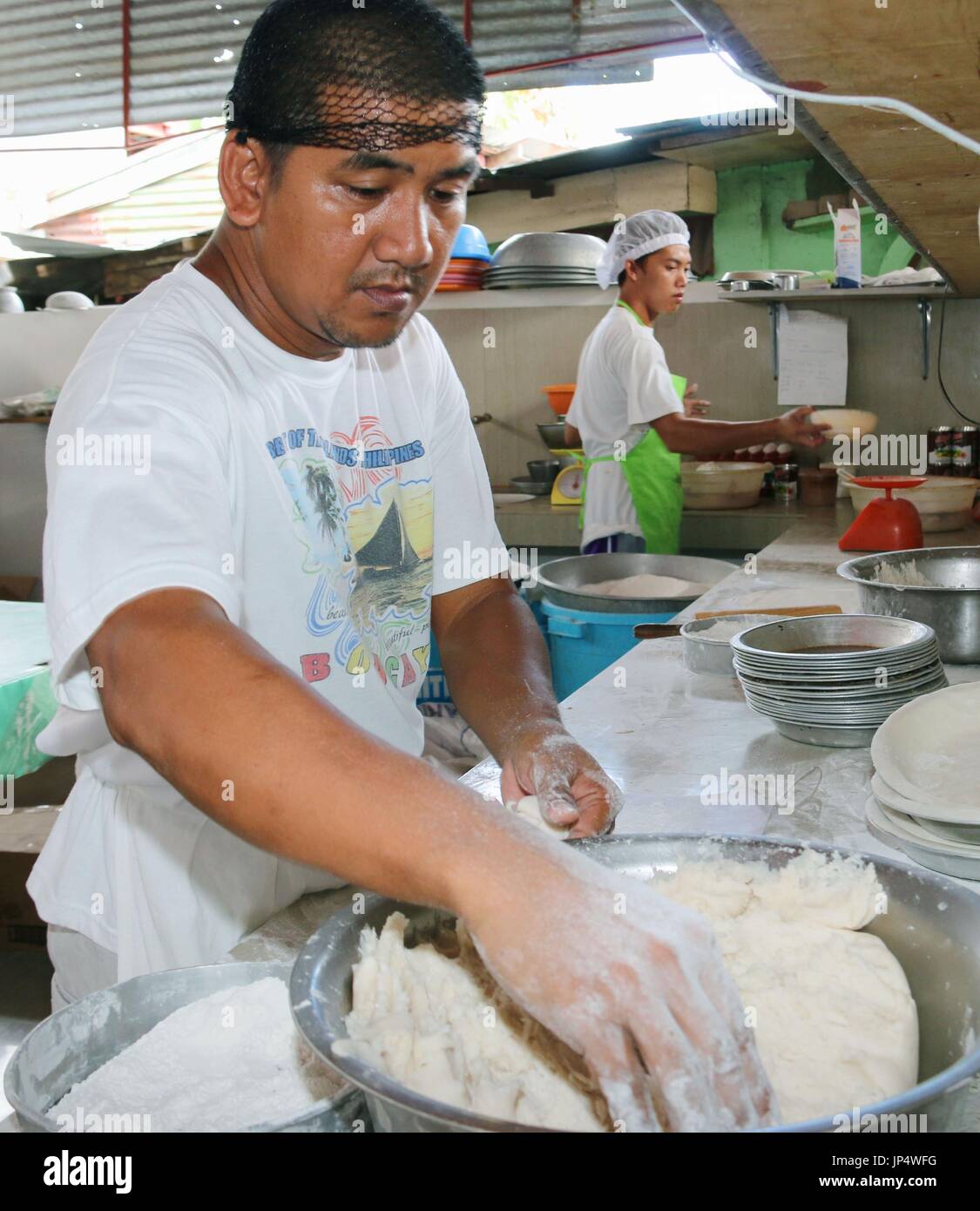 LOS BANOS, Philippines - Workers produce Buko pies in Los Banos in the ...
