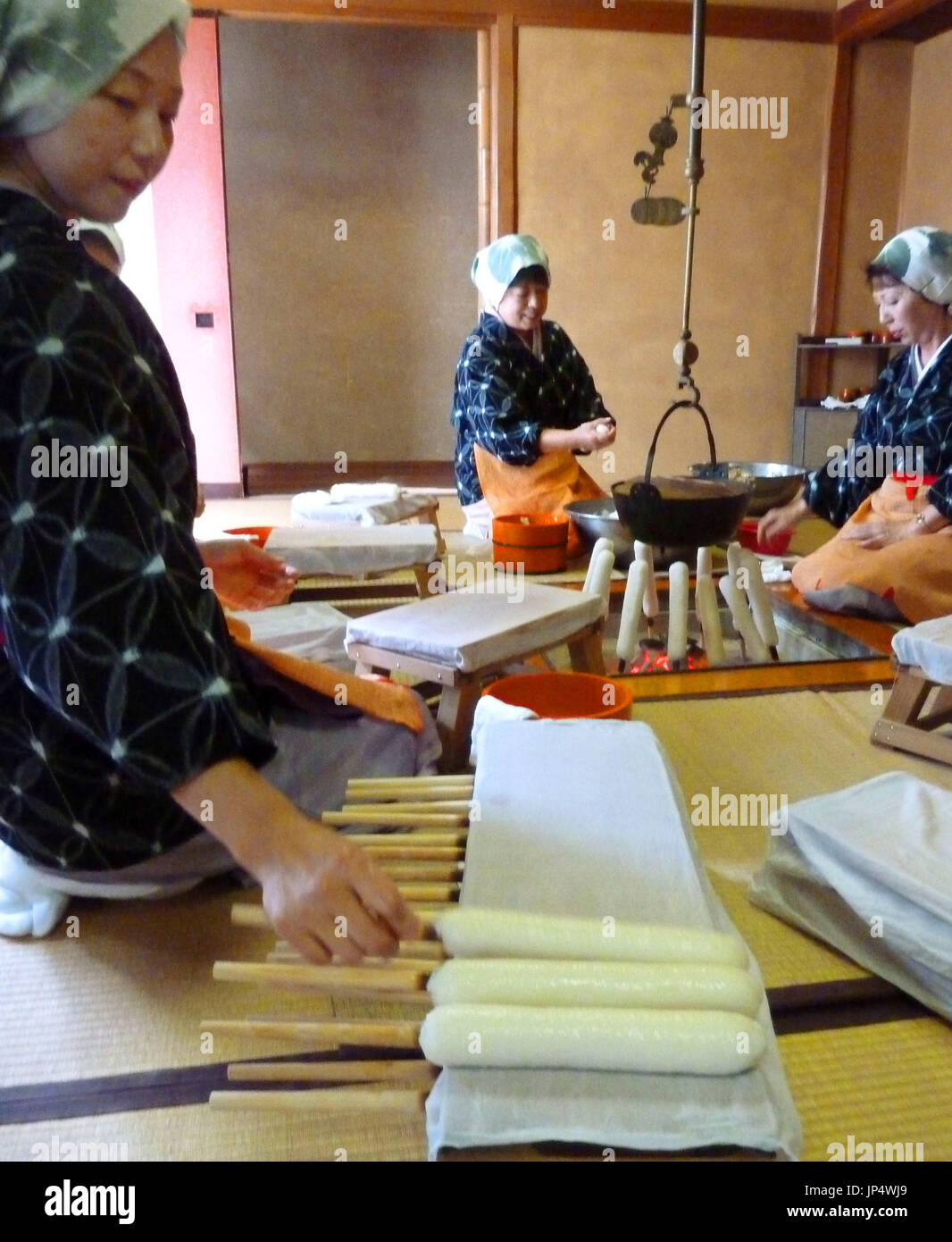 AKITA, Japan - Women workers clad in traditional costume produce ...