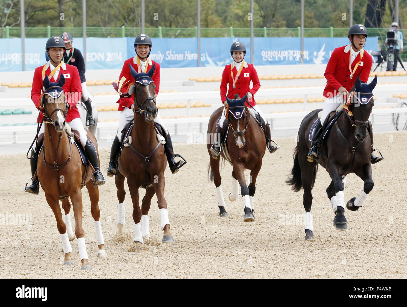 INCHEON, South Korea - Japanese equestrians celebrate after winning the ...