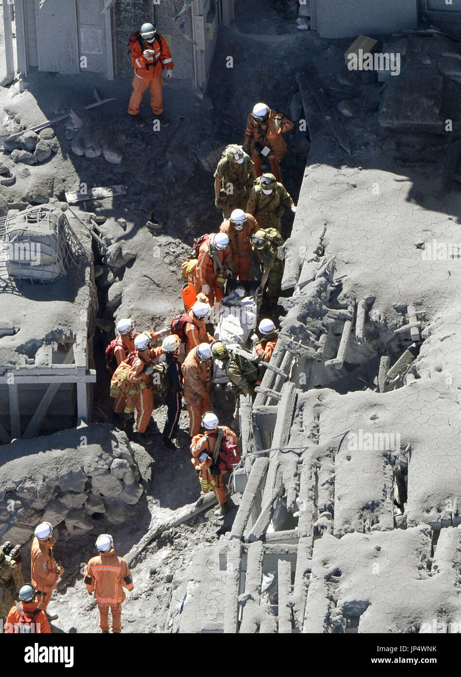 OSAKA, Japan - Firefighters and members of Japan's Ground Self-Defense Force engage in rescue ...