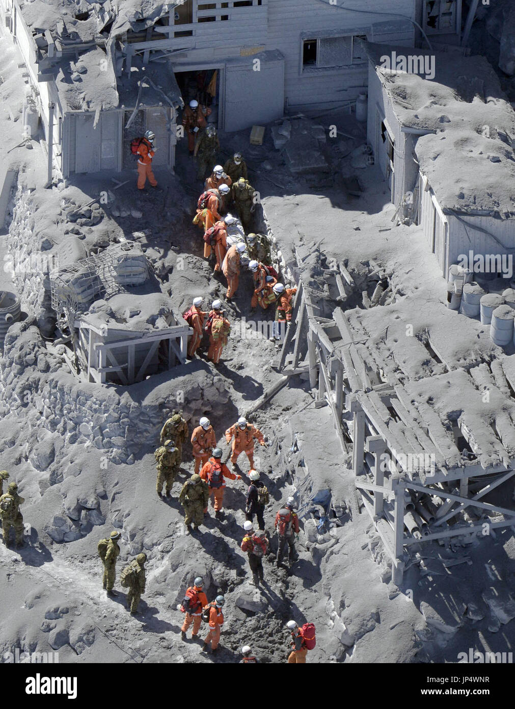 OSAKA, Japan - Firefighters and members of Japan's Ground Self-Defense Force engage in rescue ...