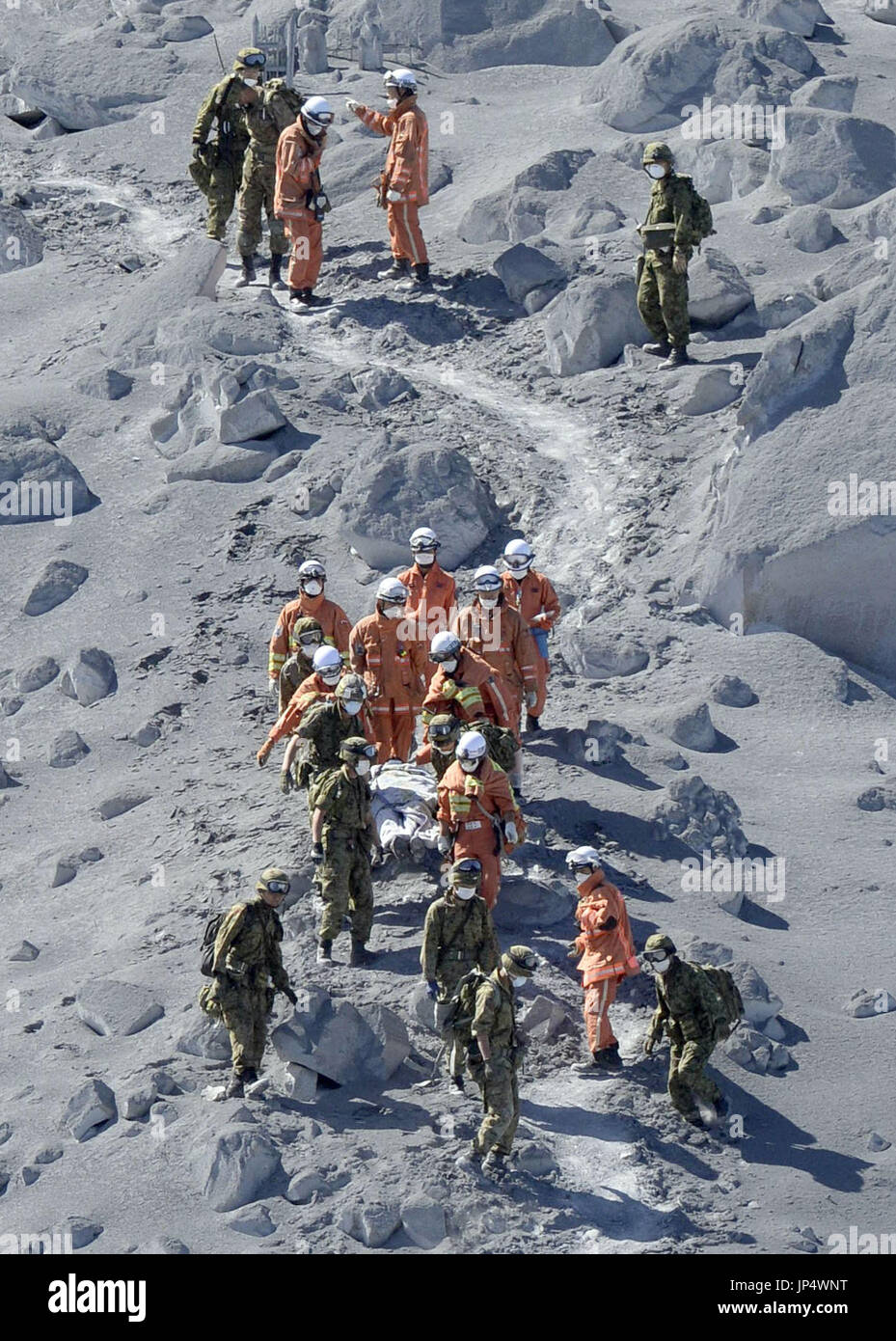 OSAKA, Japan - Firefighters and members of Japan's Ground Self-Defense Force engage in rescue ...