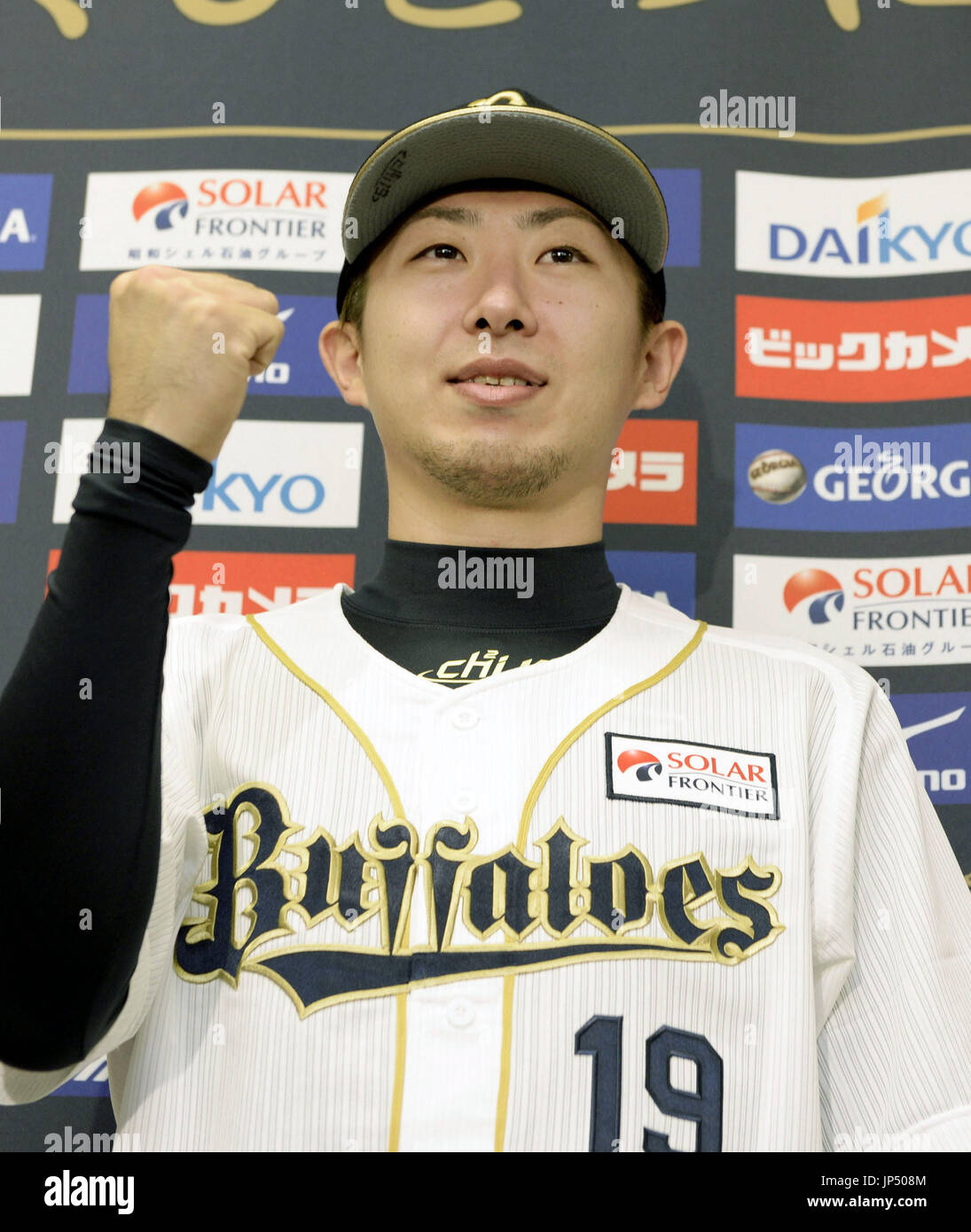 KOBE, Japan - Orix Buffaloes ace Chihiro Kaneko holds up his fist for ...