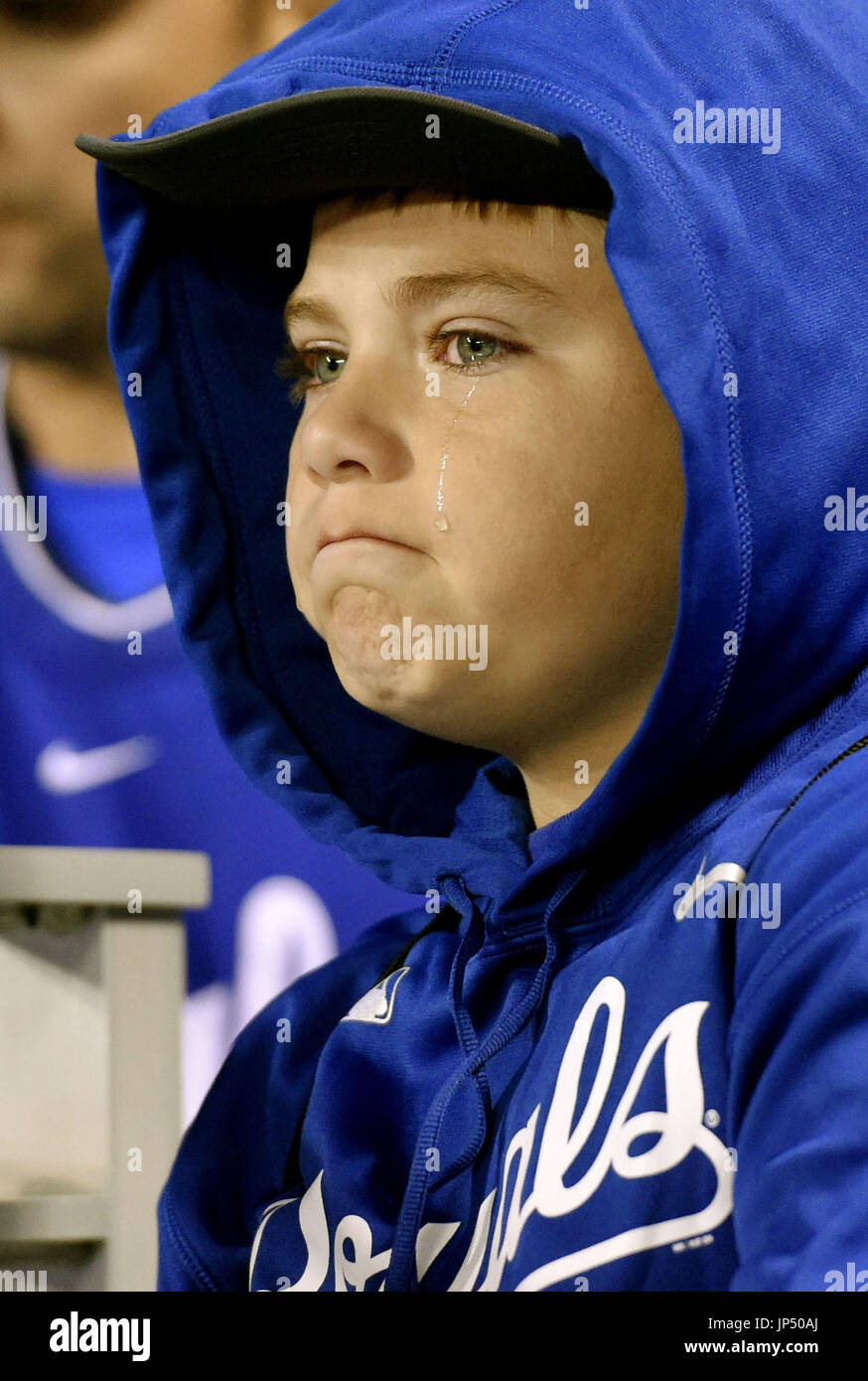 KANSAS CITY, United States - A Kansas City Royals fan sheds tears after ...