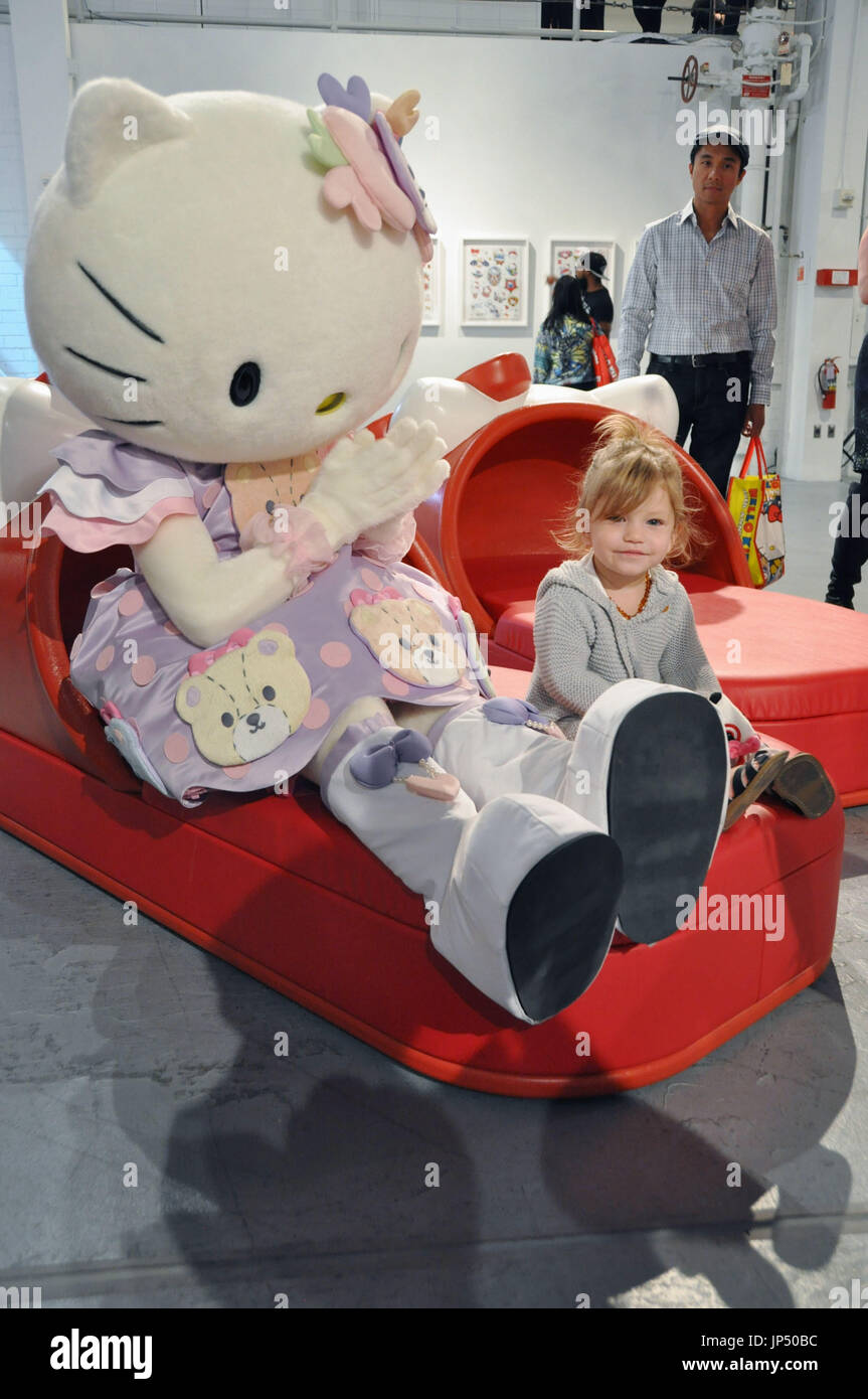 LOS ANGELES, United States - A girl sits by Hello Kitty at the Museum ...