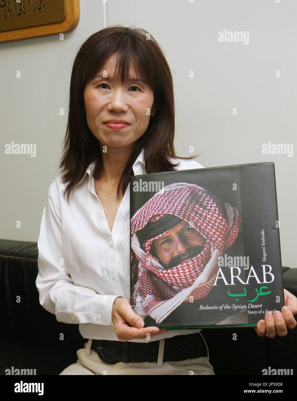 TOKYO, Japan - Japanese photographer Megumi Yoshitake holds her photo ...