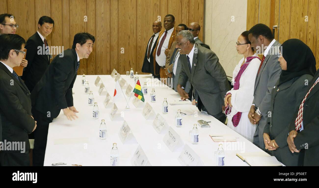 TOKYO, Japan - Prime Minister Shinzo Abe (center L) and Abadulla Gemeda ...