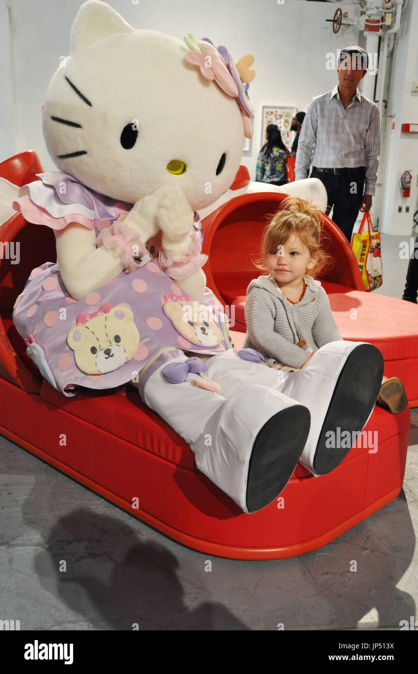 LOS ANGELES, United States - A girl sits by Hello Kitty at the first ...