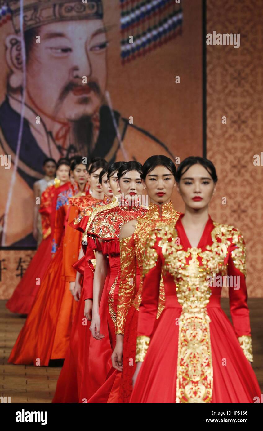 BEIJING, China - Models walk down the runway during China Fashion Week ...