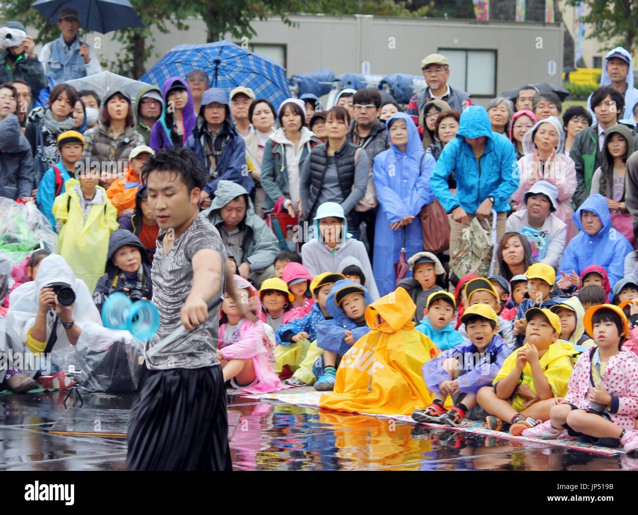 SHIZUOKA, Japan - A street performer shows off his skills in the city ...