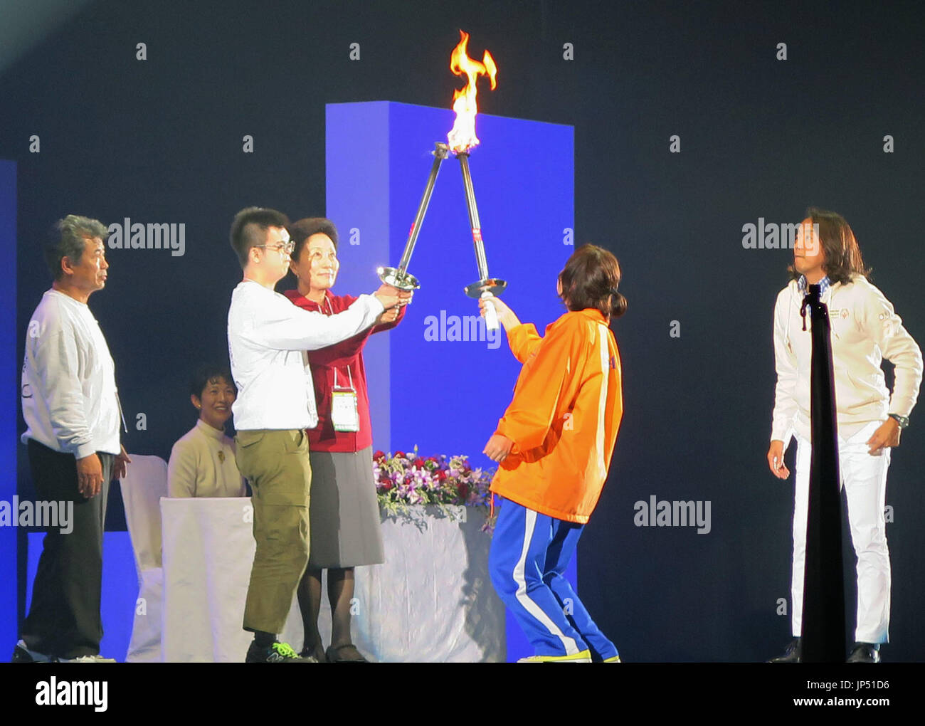 FUKUOKA, Japan - A torch relay is held during an opening ceremony of ...