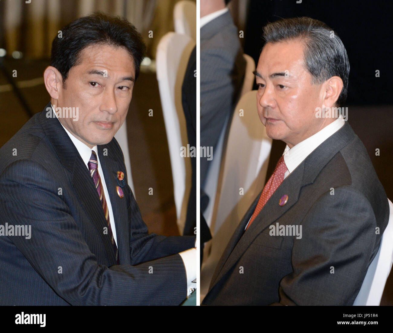 BEIJING, China - Combination photo shows Japanese Foreign Minister Fumio Kishida (L) and Chinese ...