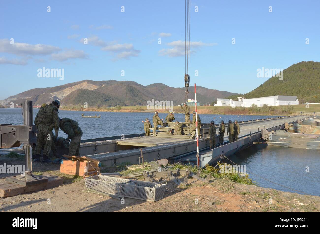 SENDAI, Japan - Members of the Japan Self-Defense Forces build a ...