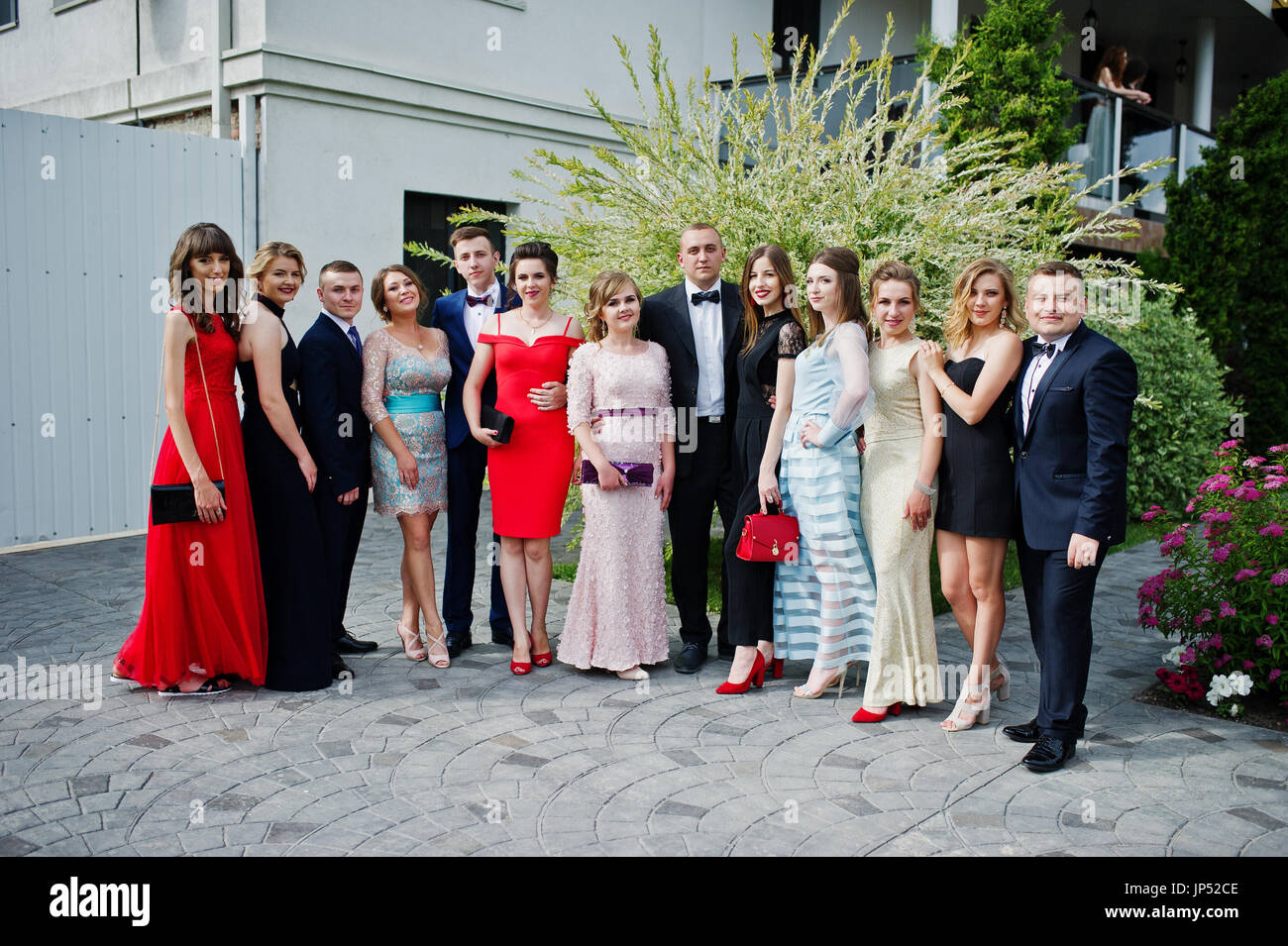 Group of good-looking graduates posing on the graduation day next to ...