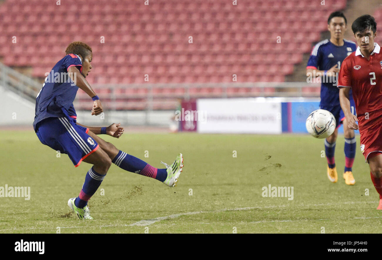 BANGKOK, Thailand - Japan under-21 player Musashi Suzuki (L) scores the ...