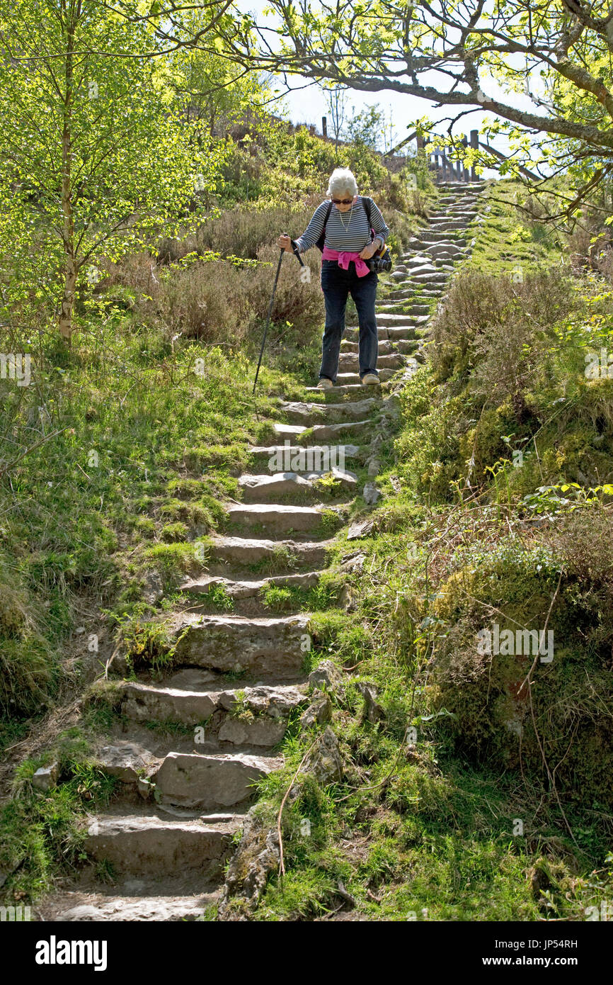 Senior woman walking down steps Elan Valley Wales UK Stock Photo - Alamy