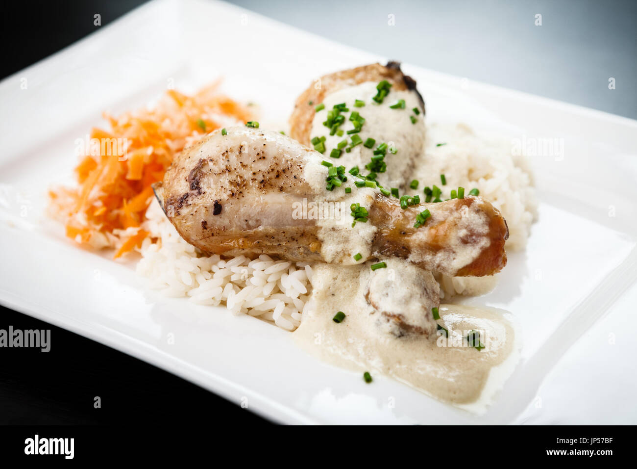 Chicken legs with rice Stock Photo - Alamy