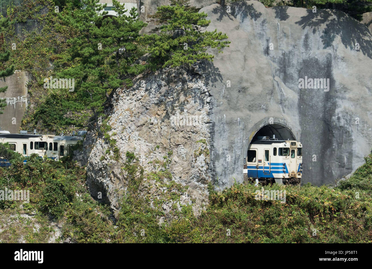 AOMORI, Japan - A train passes through the 9.5-meter Sembokuiwa Tunnel ...