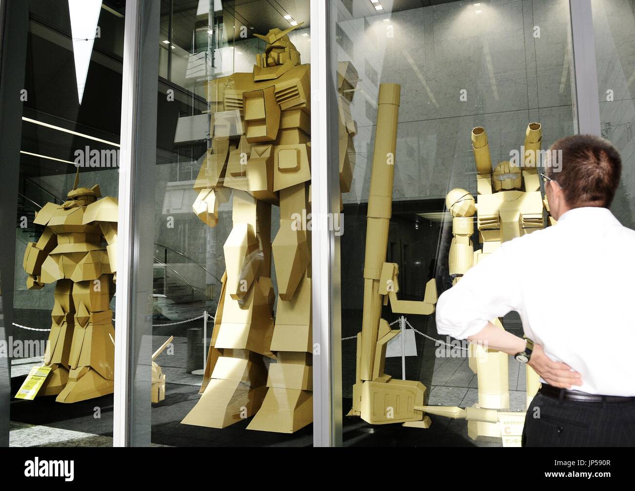 OSAKA, Japan - Cardboard likenesses of robots from the popular "Gundam ...