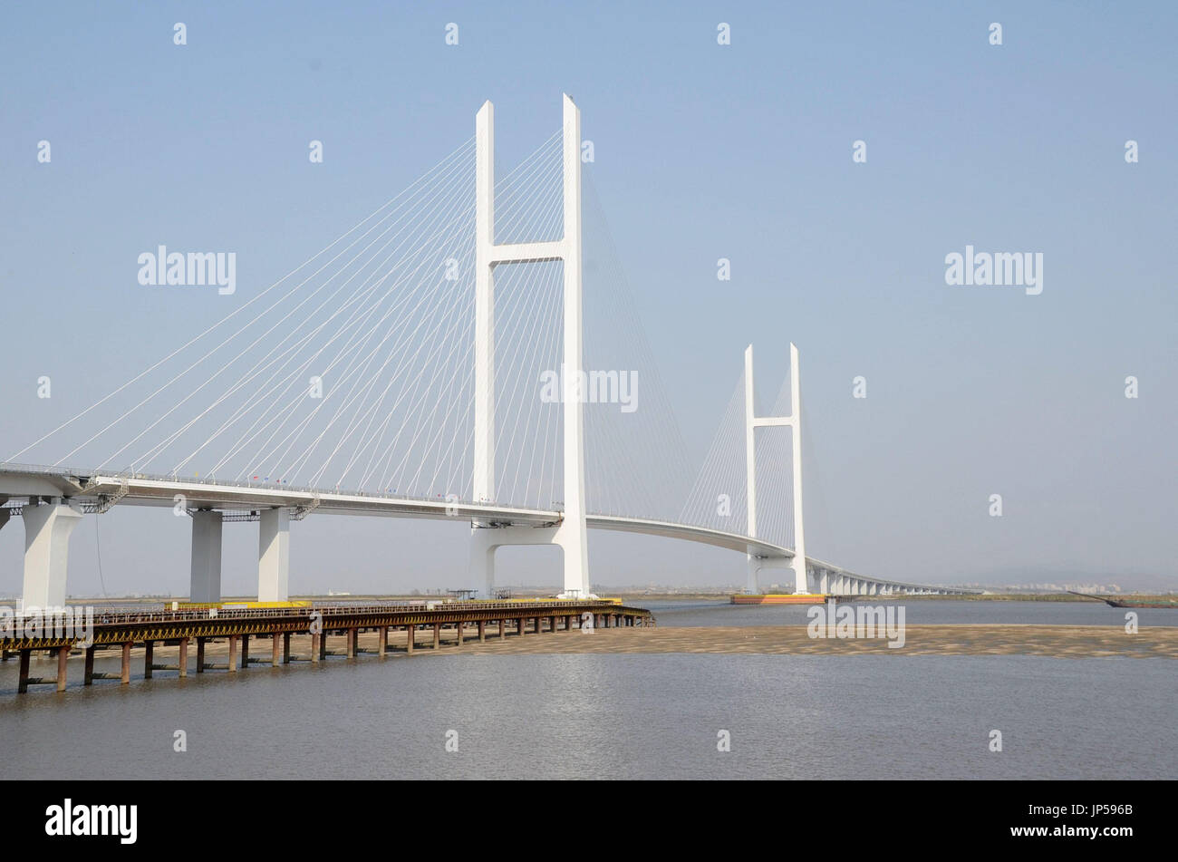DANGDONG, China - A new bridge over the Yalu River, seen in this photo ...