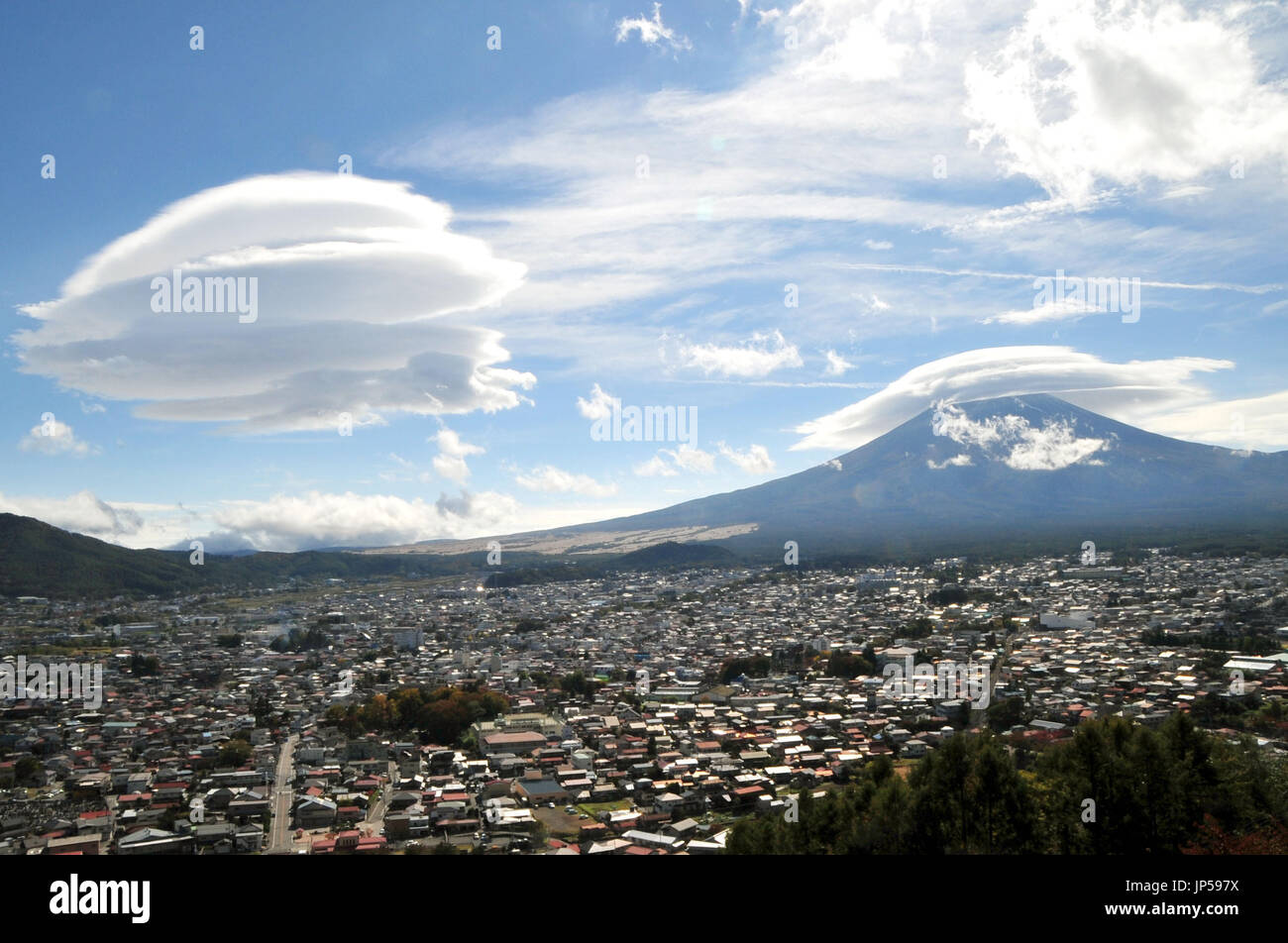 KOFU, Japan - A cap cloud covers the top of Mt. Fuji next to lenticular ...