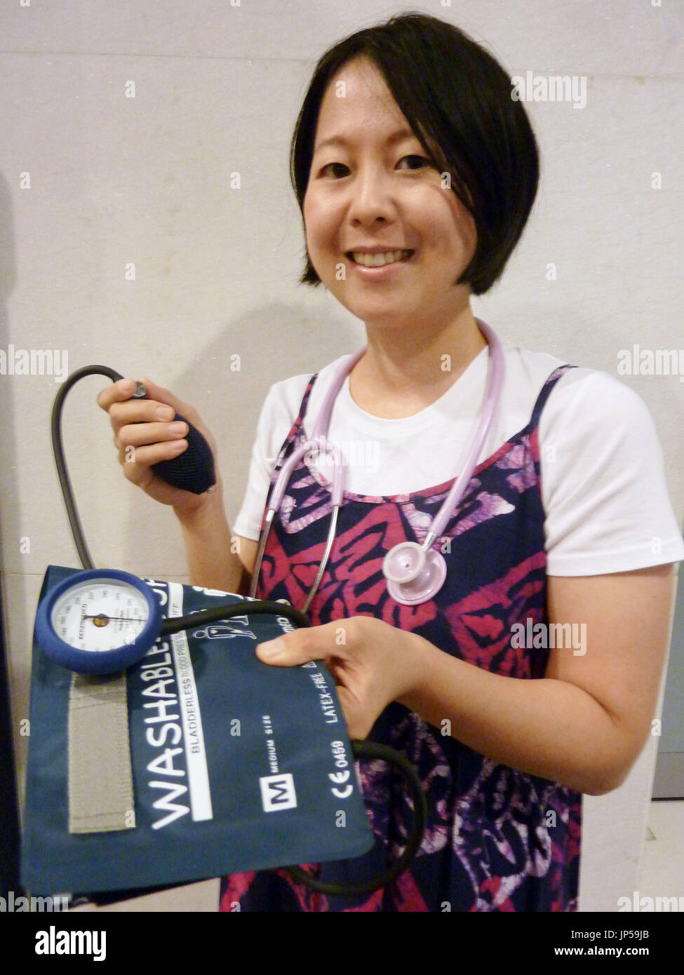 TOKYO, Japan - Japanese nurse Eri Kanki displays a medical device she ...