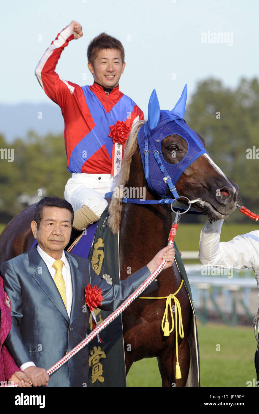 KYOTO, Japan - Jockey Manabu Sakai celebrates on Toho Jackal after ...
