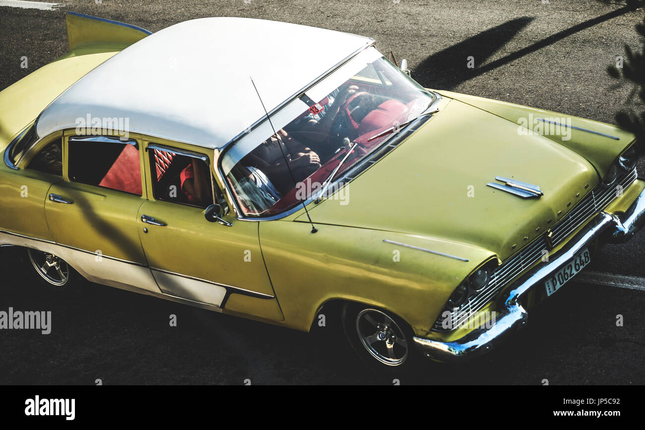 High angle shot of a classic 1950s car driving on a road Stock Photo ...