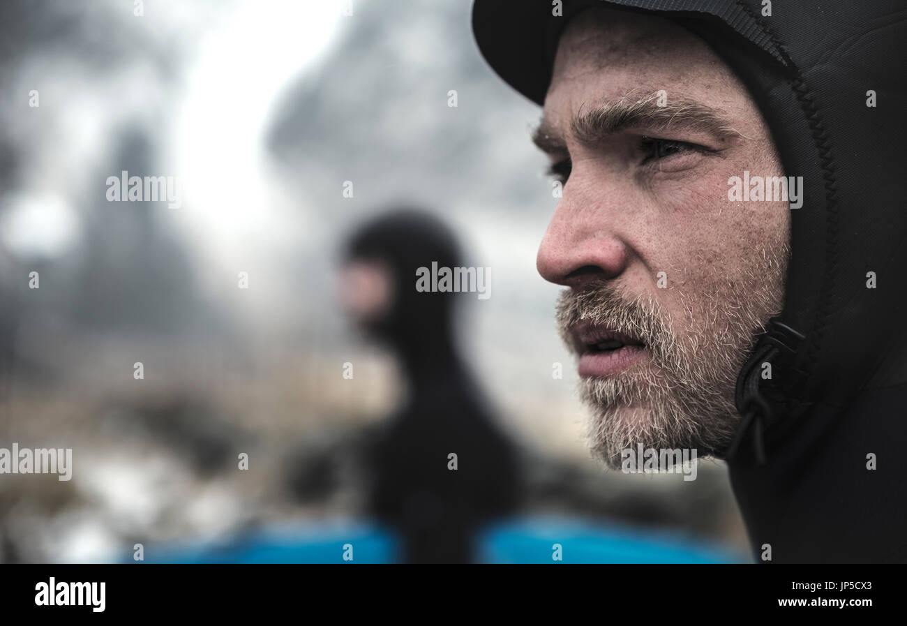 Close up of the head of a surfer wearing a wetsuit Stock Photo - Alamy