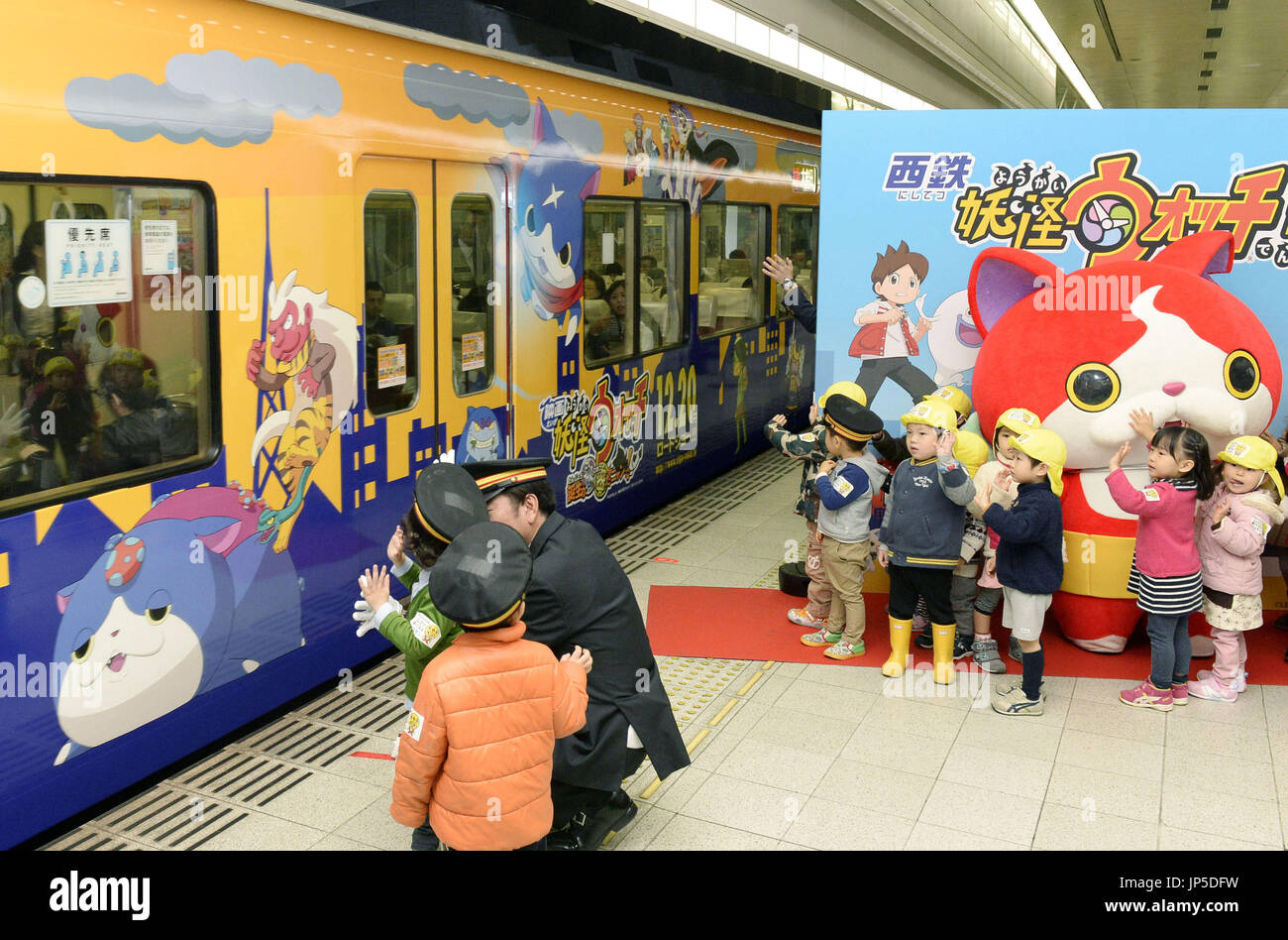 FUKUOKA, Japan - Children wave at Nishi-Nippon Railroad Co.'s train ...