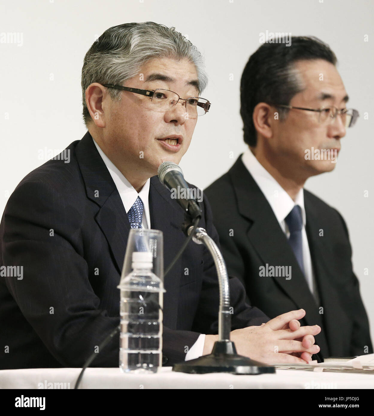 OSAKA, Japan - Masataka Watanabe (L) and Shinya Iida hold a press ...