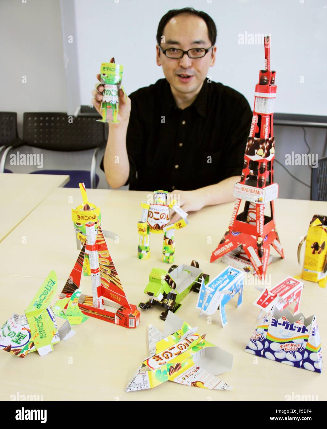 TOKYO, Japan - Kazuma Takahashi shows off his package craftwork in ...