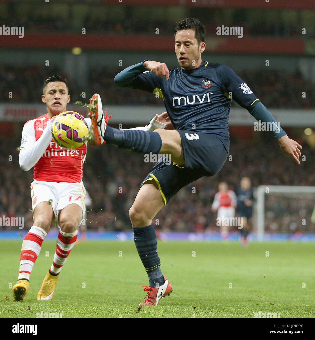 LONDON, Britain - Maya Yoshida (R) of Southampton clears the ball in ...