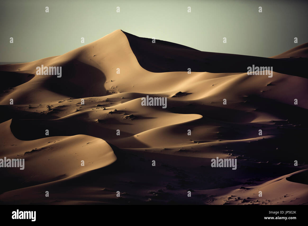 Sand dunes in wave shapes, formed by the action of wind and weather, in ...