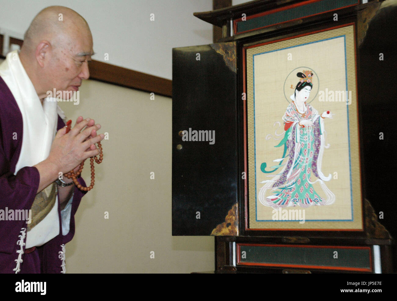 NARA, Japan - A Buddhist monk prays before the re-created painting of ...