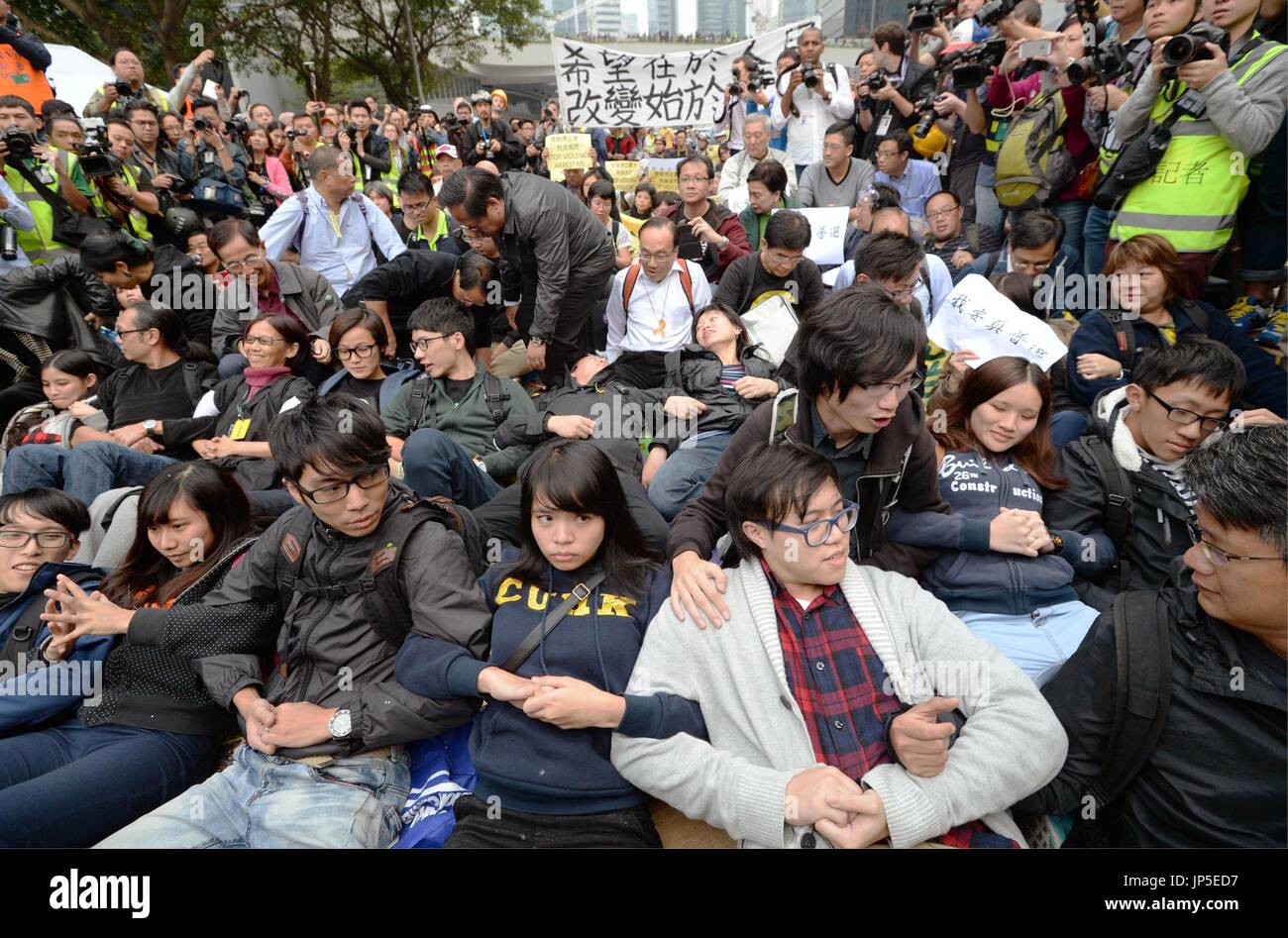 HONG KONG, China - Pro-democracy protesters lock arms with each other ...