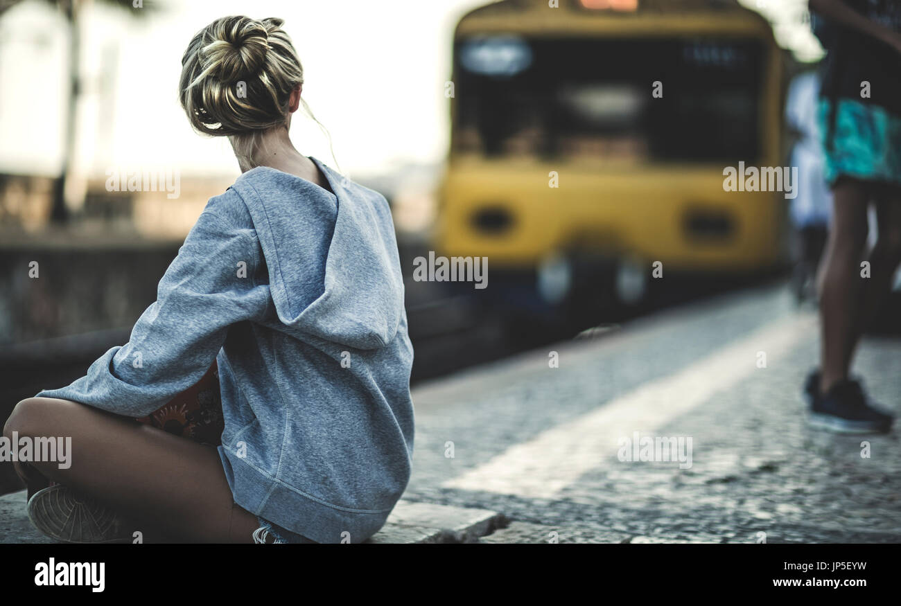 Woman on train platform behind hi-res stock photography and images - Alamy