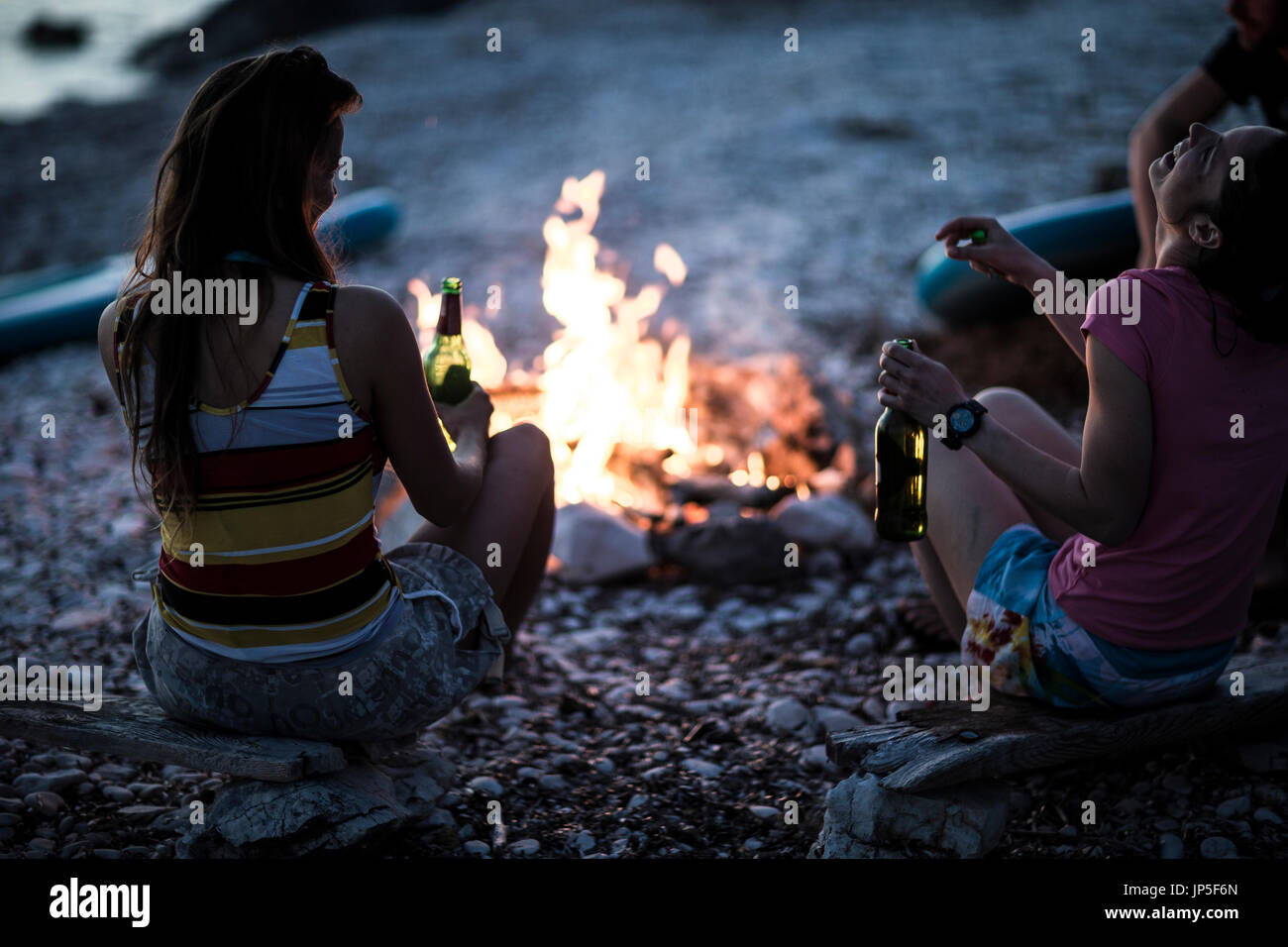 Gathered around campfire hi-res stock photography and images - Alamy