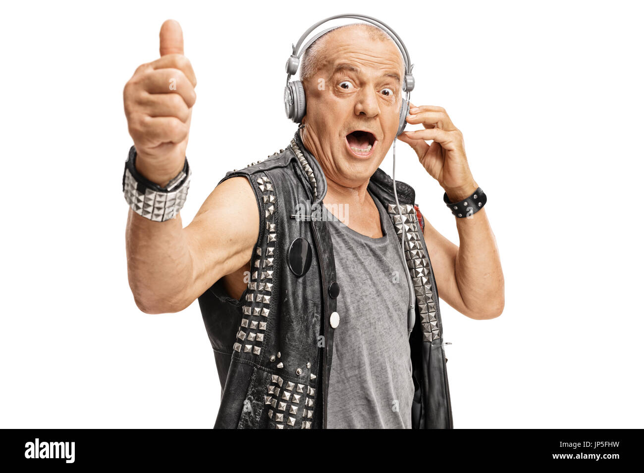 Elderly punker with headphones holding his thumb up isolated on white ...