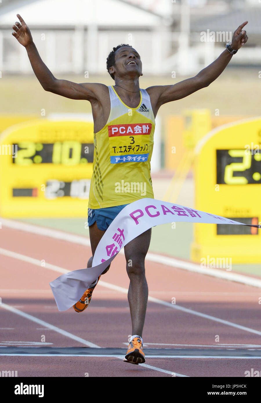 Eritrea's Tewelde Estifanos crosses the finishing line at Oita City ...