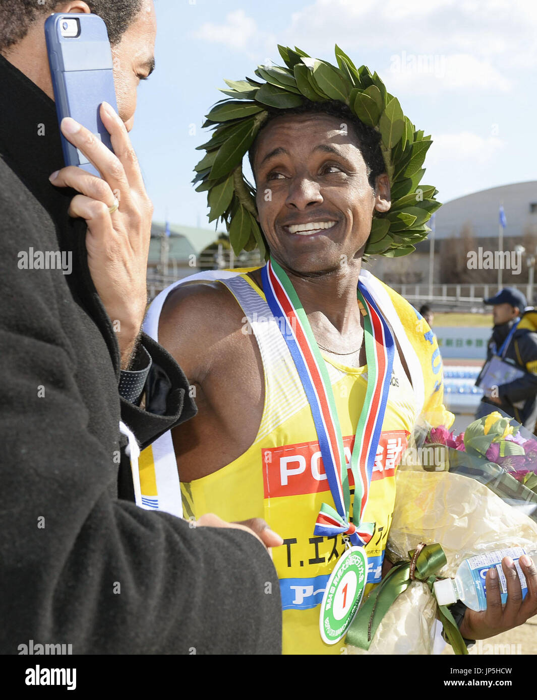 Eritrea's Tewelde Estifanos is congratulated at Oita City Athletic ...