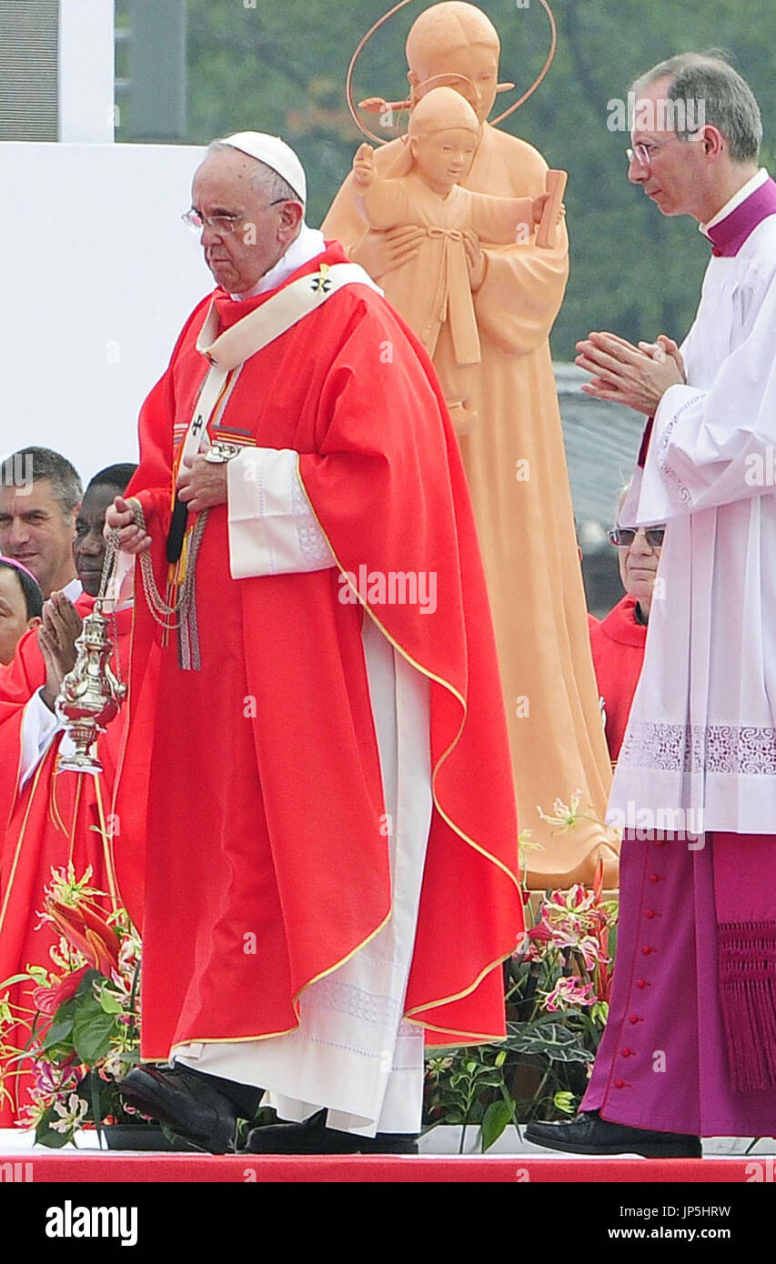 SEOUL, South Korea - Pope Francis (L) walks past a statue of the Virgin ...