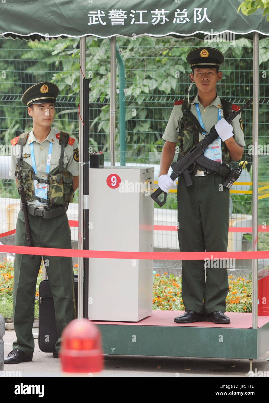 NANJING, China - Armed police officers stand guard near the Nanjing ...