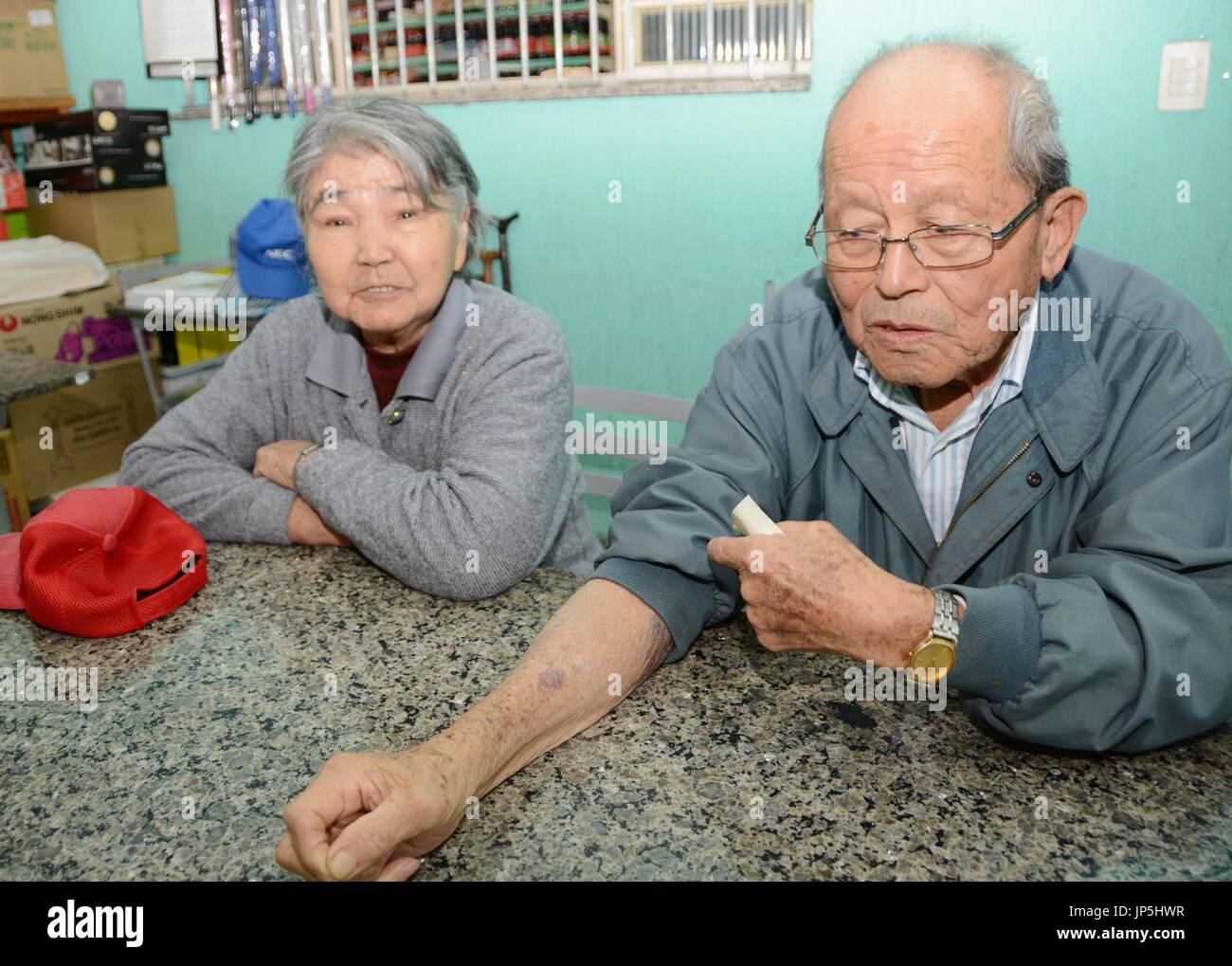 FUKUOKA, Japan - Yoshitaka Samejima (R) shows in Sao Paulo, Brazil, on ...