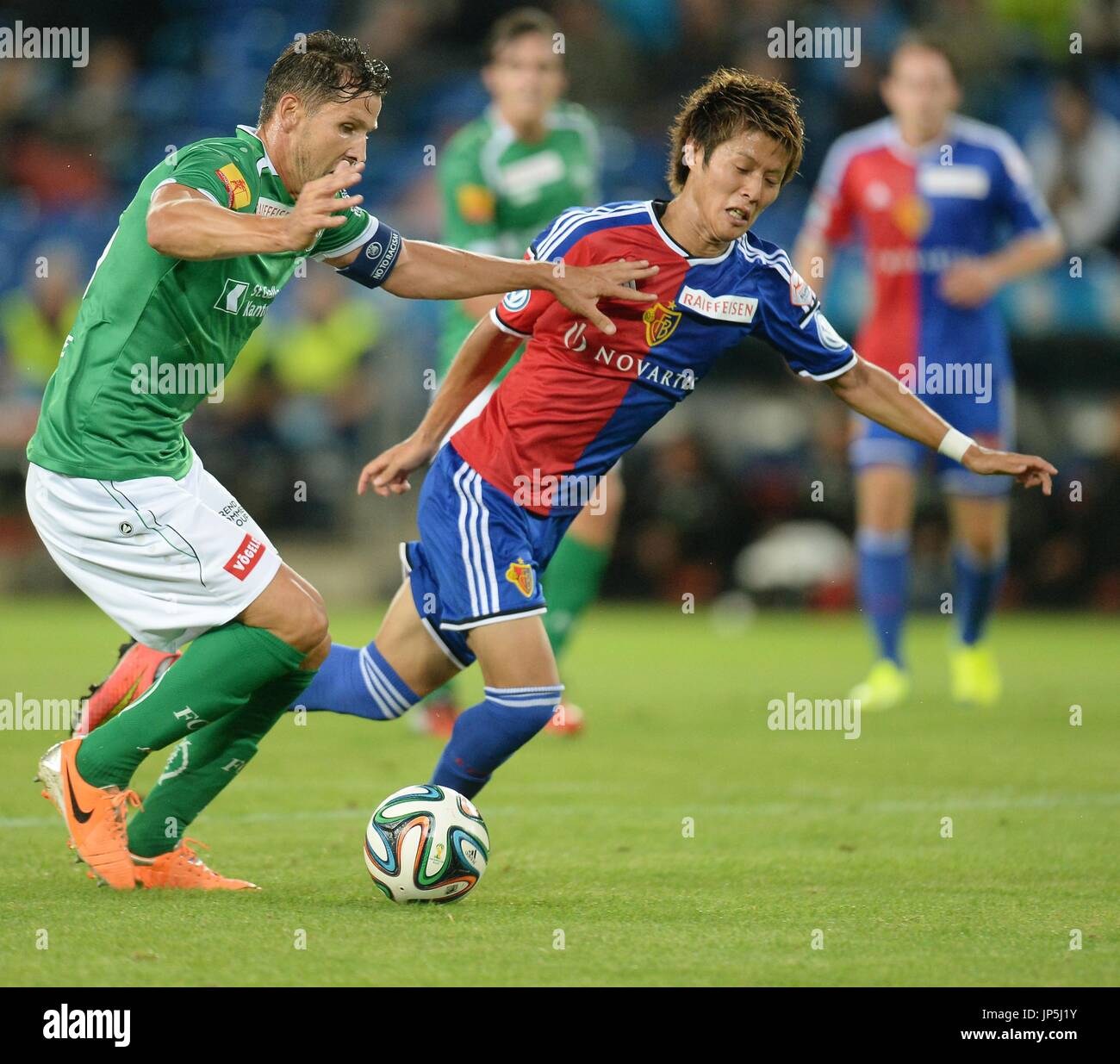 BASEL, Switzerland - Japan's Yoichiro Kakitani (R) of FC Basel fights ...